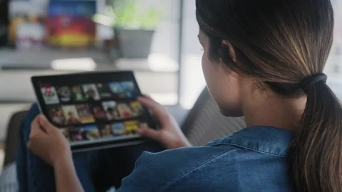 1 Woman Choosing Movie From Streaming Ca... | Stock Video | Pond5