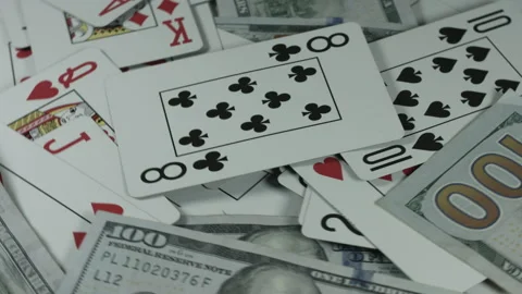 $100 Bills Cascade Onto Playing Cards Ro... | Stock Video | Pond5