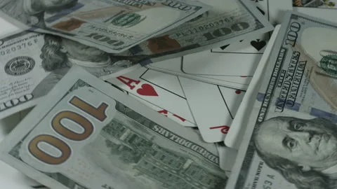 $100 Bills Cascade Onto Playing Cards Ro... | Stock Video | Pond5
