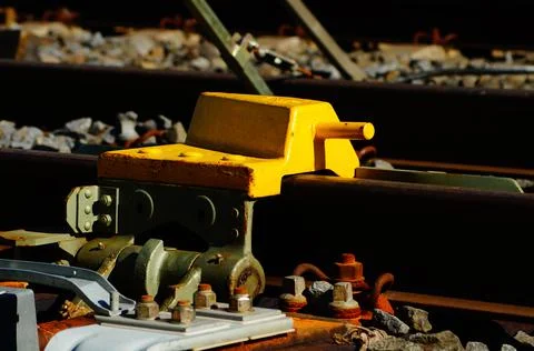 A derailer blocks a track at a switch in a railway construction site ...