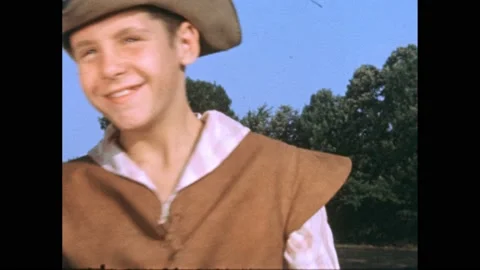 1700s: Colonial boy in field turns and s... | Stock Video | Pond5