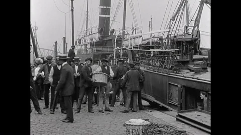 1920s - Cargo is loaded into a steamer i... | Stock Video | Pond5