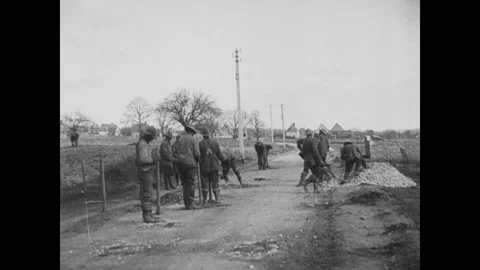1920s: Men work on road. Man drives heav... | Stock Video | Pond5