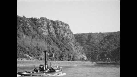 1920s: Steamboat sails down river near c... | Stock Video | Pond5