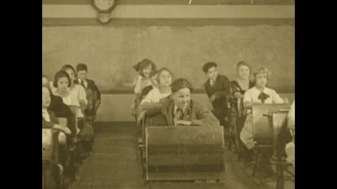 1920s: Students in class nod their heads... | Stock Video | Pond5