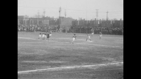 1920s: UNITED STATES: men run after ball... | Stock Video | Pond5