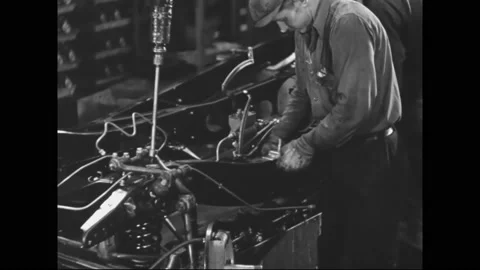 1930s - Car factory workers use a pneuma... | Stock Video | Pond5