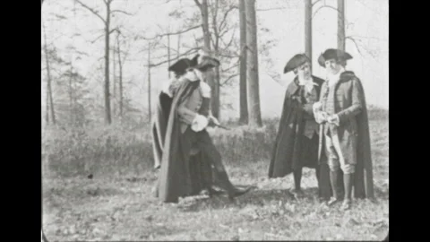 1930s: Duel. Men stand back to back. M... | Stock Video | Pond5