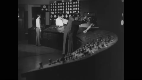 1930s - Engineers go over equipment at a... | Stock Video | Pond5