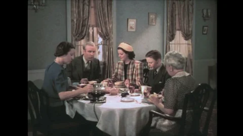 1930s: Family eats breakfast and talks a... | Stock Video | Pond5