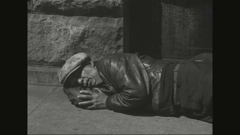 1930s - A homeless man is seen sleeping ... | Stock Video | Pond5