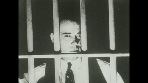 1930s: John Dillinger behind bars. Polic... | Stock Video | Pond5