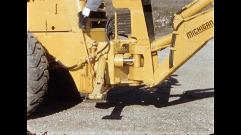 1930s: Michigan backhoe loader, man pull... | Stock Video | Pond5