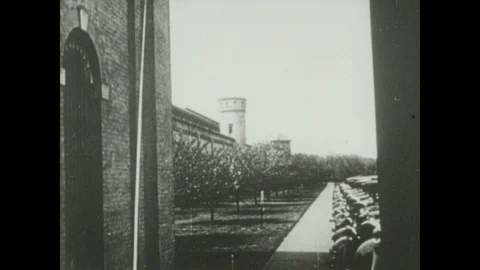 1930s: Prison buildings. Guards pace in ... | Stock Video | Pond5