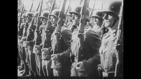 1930s: Soldiers march and salute. Men sh... | Stock Video | Pond5