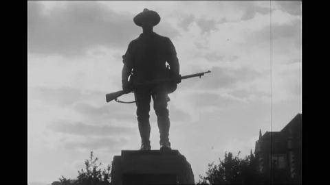 1930s: Statue of person holding gun. Men... | Stock Video | Pond5