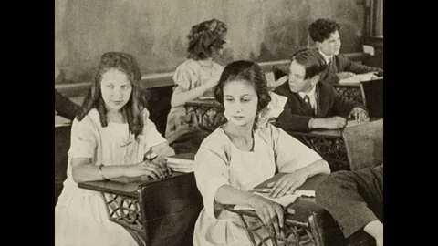 1930s: Students in a classroom talk and ... | Stock Video | Pond5