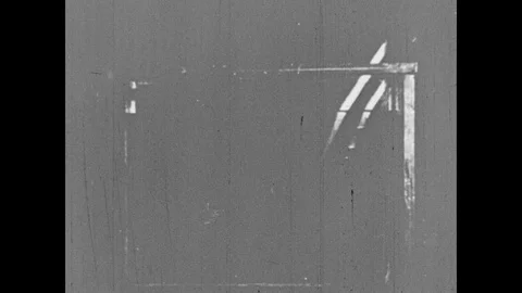 1930s: Title card. Light beams shine ont... | Stock Video | Pond5