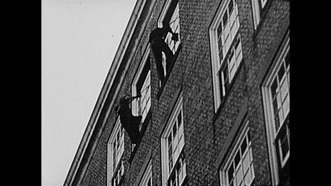 1930s: Two window washers on the exterio... | Stock Video | Pond5