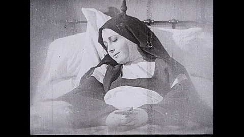 1930s: UNITED STATES: dead nun in bed. L... | Stock Video | Pond5
