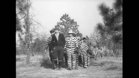 1938 - A prison guard marches chain gang... | Stock Video | Pond5