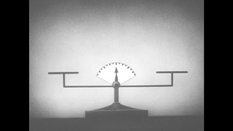 1940s: Animated scale holds two beakers ... | Stock Video | Pond5