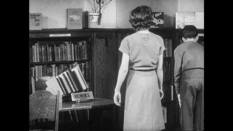 1940s: Boy and librarian stand in childr... | Stock Video | Pond5