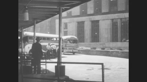 1940s: Bus pulls into bus station. Atten... | Stock Video | Pond5