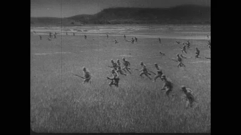 1940s China: Soldiers run across field. ... | Stock Video | Pond5