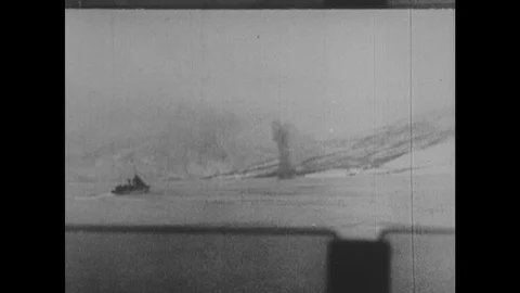 1940s: EUROPE: ships fire on coastline. ... | Stock Video | Pond5