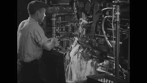 1940s - A factory worker uses a machine ... | Stock Video | Pond5