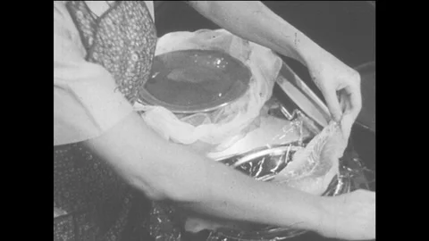 1940s: Hands cut fish fillet. Hands wrap... | Stock Video | Pond5