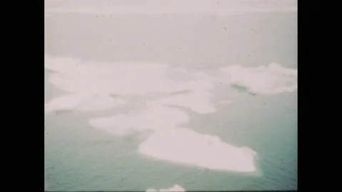 1940s: Ice floes on ocean. Man stand on ... | Stock Video | Pond5