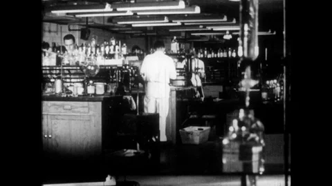 1940s: Male scientists stand in laborato... | Stock Video | Pond5
