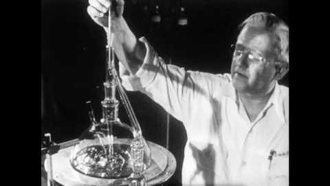 1940s: Male scientists stand in laborato... | Stock Video | Pond5