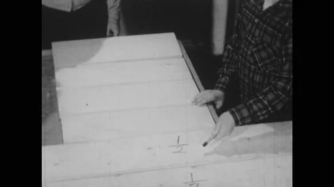 1940s: Man and boy stand at work bench. ... | Stock Video | Pond5
