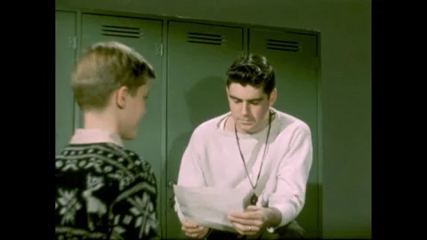 1940s: Man in locker room reading note, ... | Stock Video | Pond5