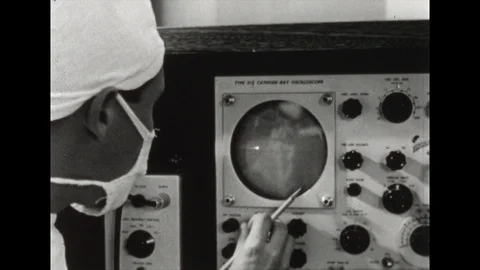 1940s: Man monitors heart monitor machin... | Stock Video | Pond5