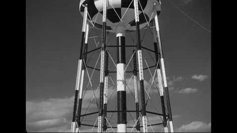 1940s: Massive water tower being built n... | Stock Video | Pond5