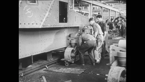 1940s: Men work on tank assembly line. T... | Stock Video | Pond5