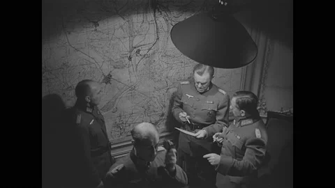 1940s: Nazi officers speak and look at p... | Stock Video | Pond5