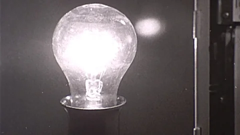 1940s Old Filament Light Bulb Burning Tu... | Stock Video | Pond5