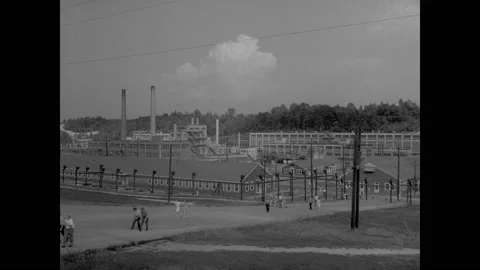 1940s: People walk from factory. People ... | Stock Video | Pond5