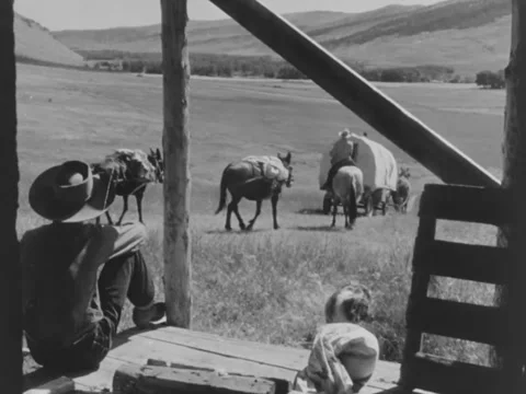 1940s: Rancher watches another leave wit... | Stock Video | Pond5