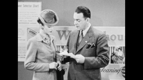 1940s: Salesman holds folded paper. Sale... | Stock Video | Pond5