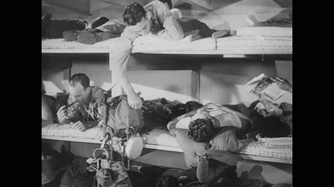 1940s: Soldiers are lined in bunks on sh... | Stock Video | Pond5