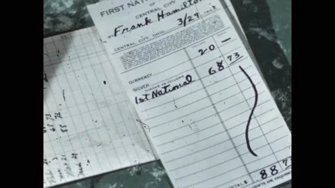 1940s: Teller inspects check and deposit... | Stock Video | Pond5
