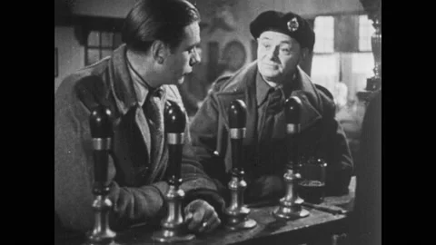 1940s: Two men talk at bar. Man and woma... | Stock Video | Pond5