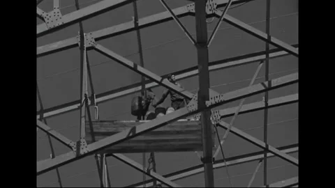 1940s: A worker inside a towering steel ... | Stock Video | Pond5