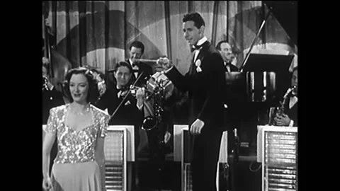 1942 - In this musical, a woman sings a ... | Stock Video | Pond5